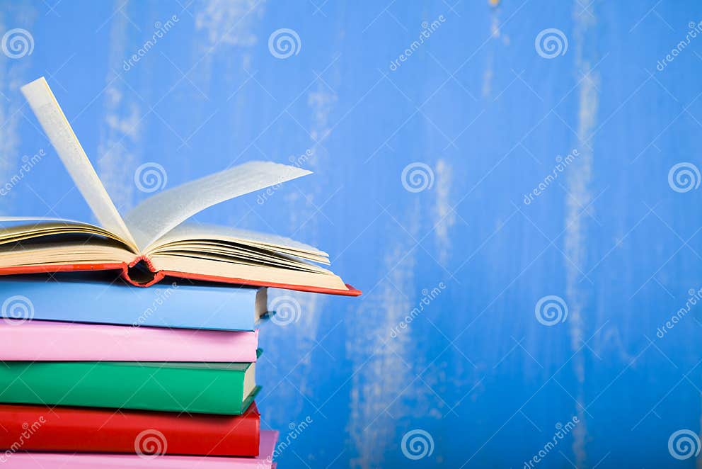Stack of Books on a Blue Background. Stock Photo - Image of education ...