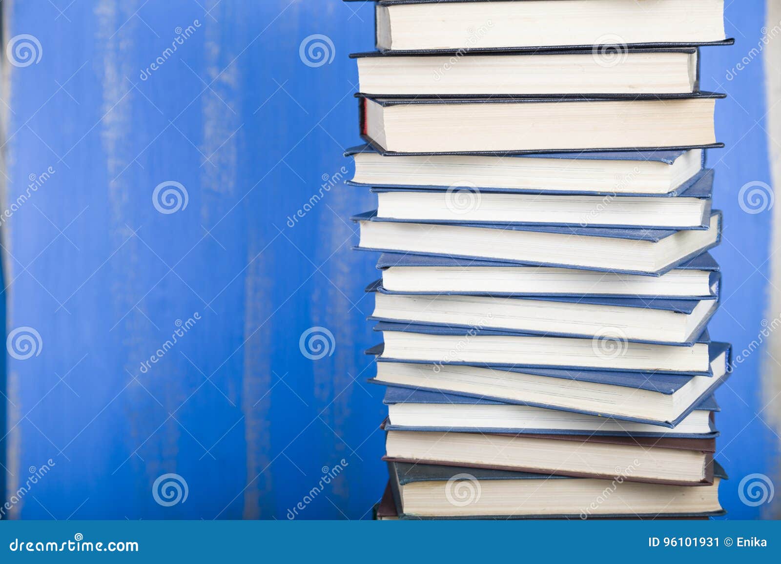 Stack of Books on a Blue Background. Stock Image - Image of back ...