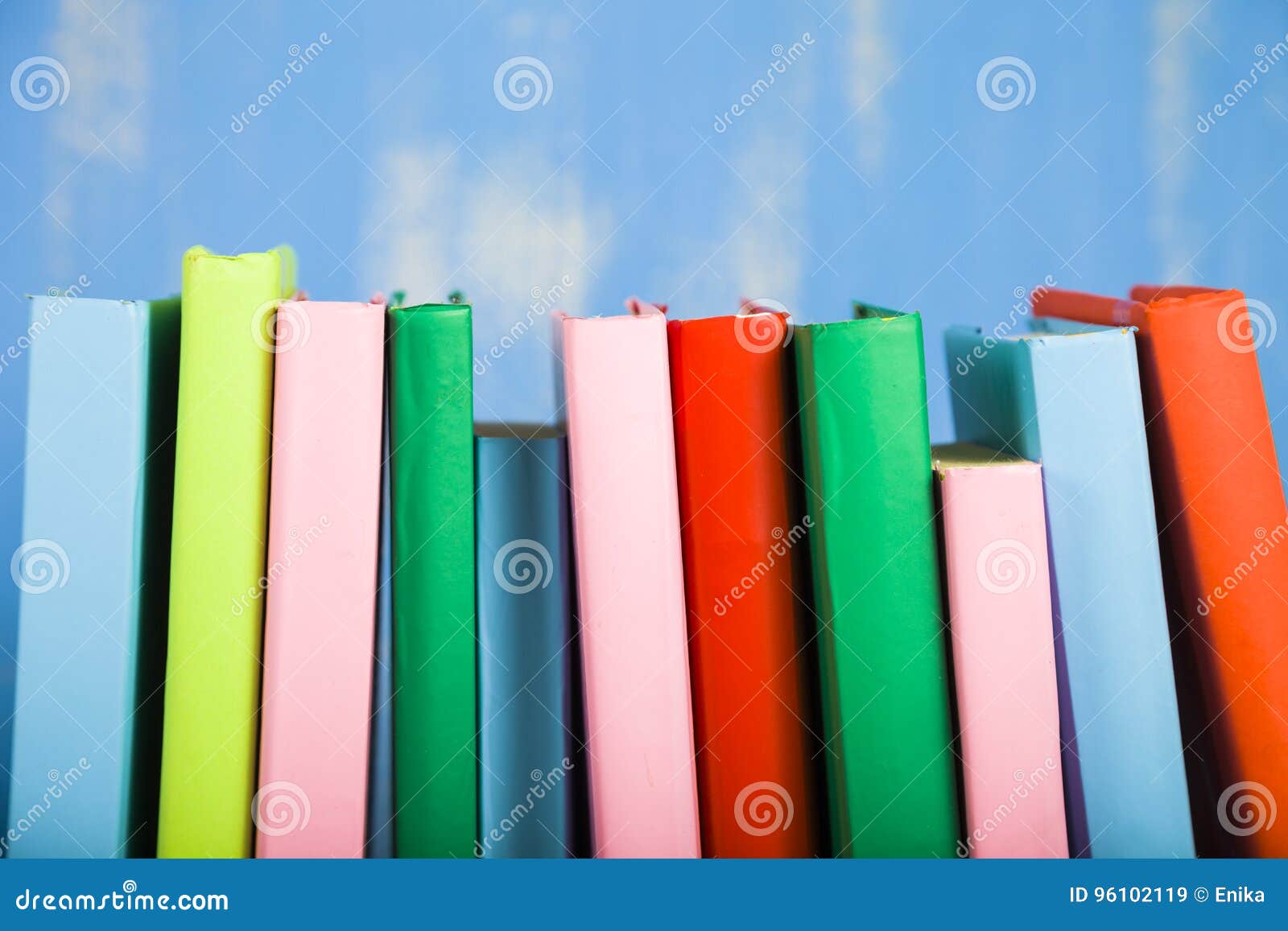 Stack of Books on a Blue Background. Stock Image - Image of business ...