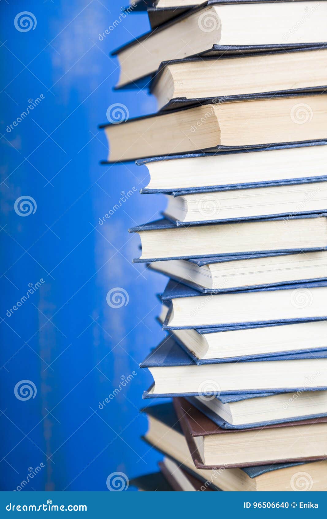 Stack of Books on a Blue Background. Stock Photo - Image of multi ...