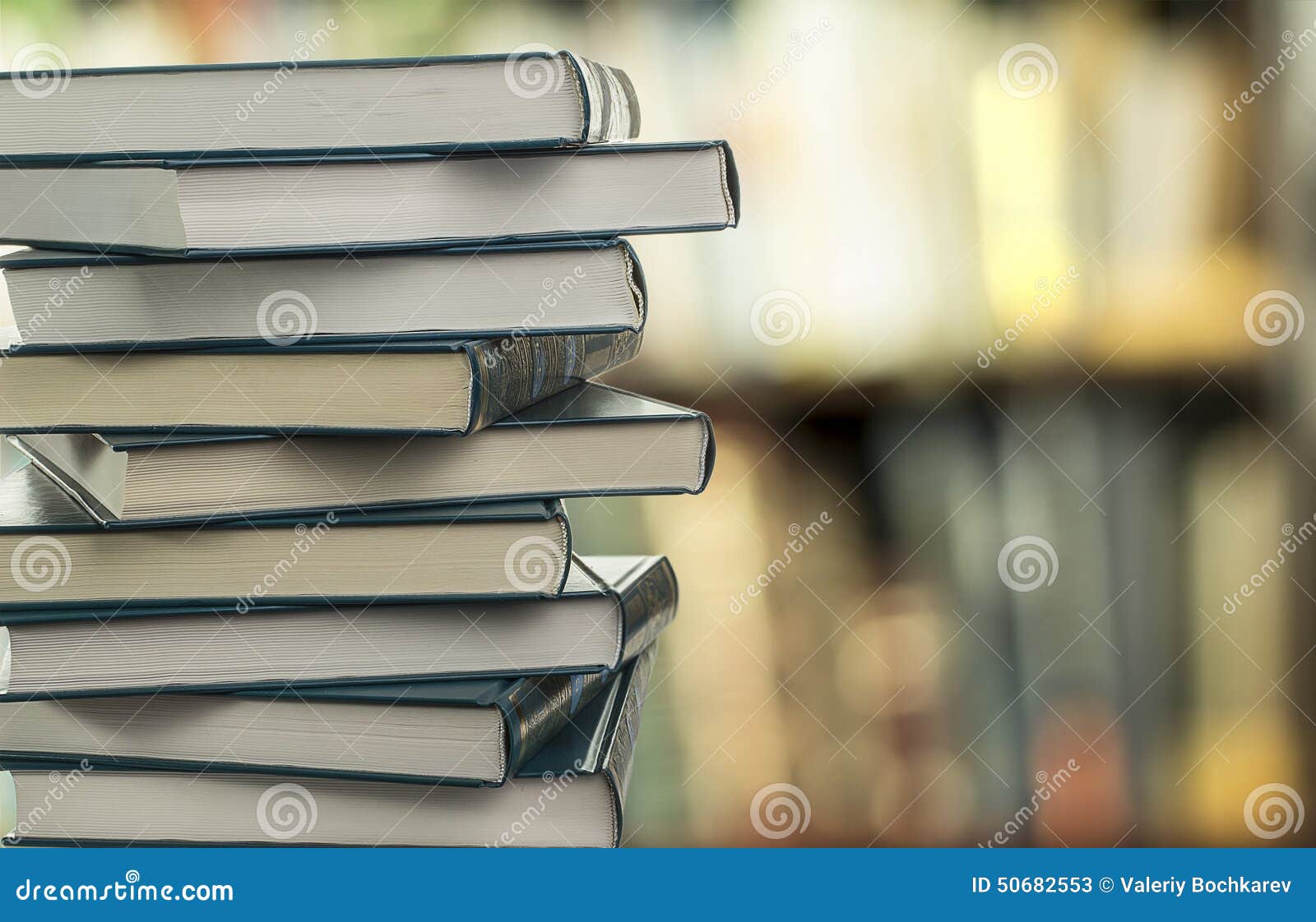 A Stack of Books on a Blurred Background Stock Image - Image of ...