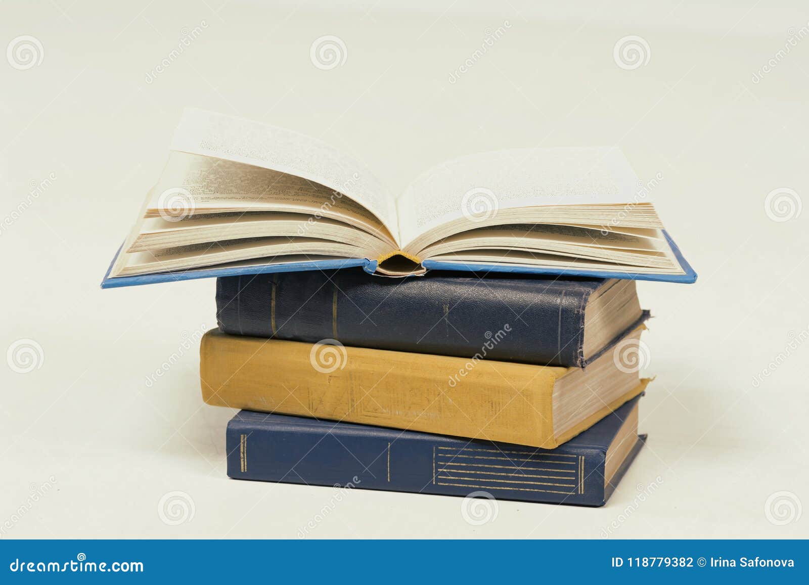 Stack of Books, a Book on the Top Open Pages, Yellow, Blue Colors Stock ...