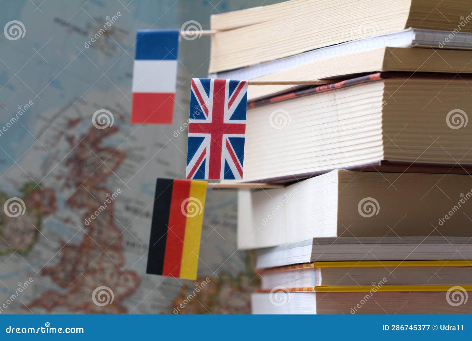 Stack of Books with Country Flags on Background of Map, Foreign ...