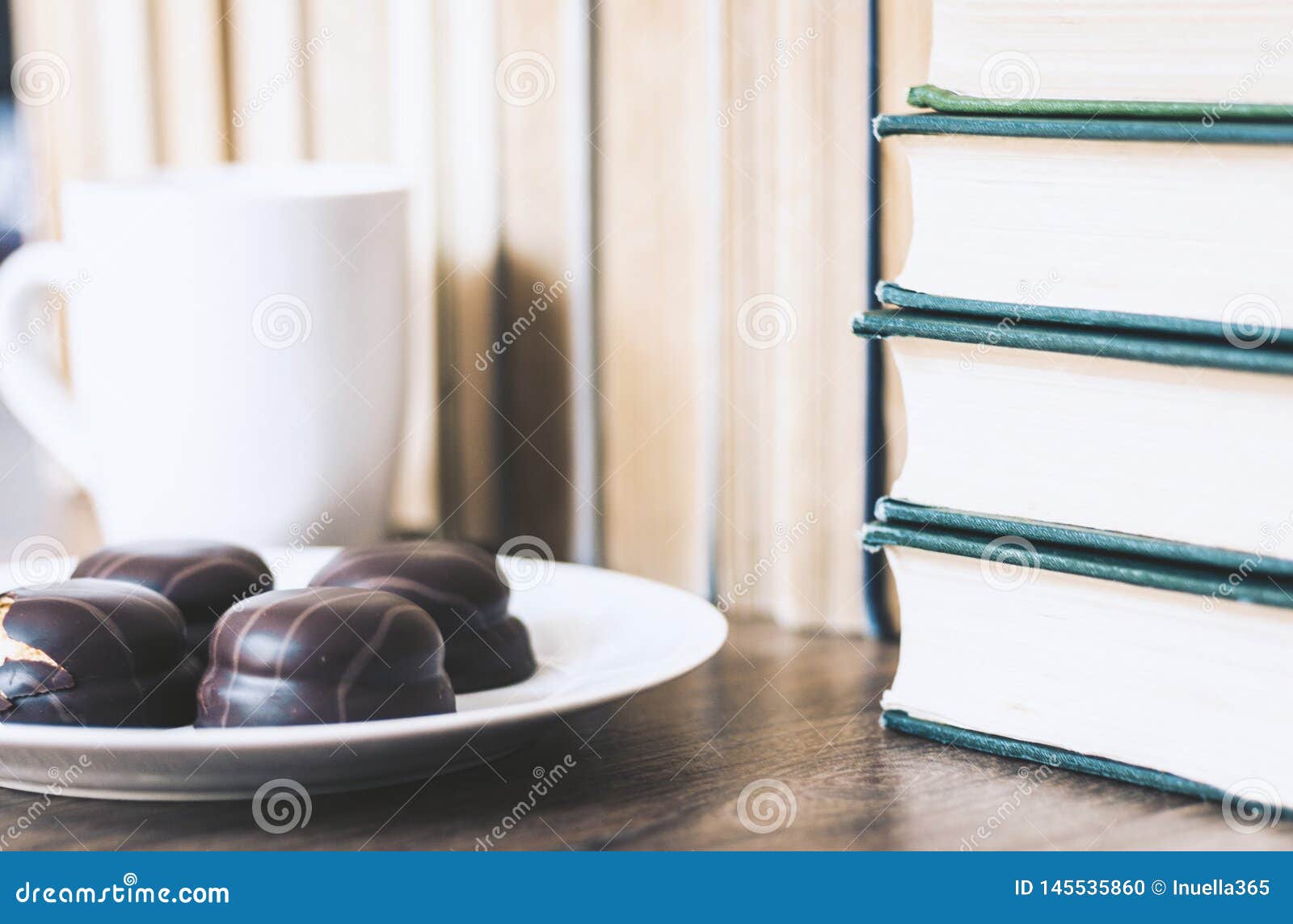 Stack of Books, Cup of Coffee and Chocolate Cookies White Plate Stock ...
