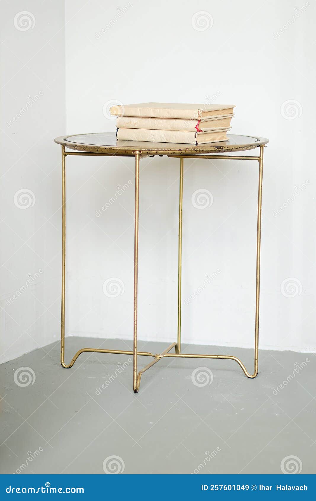 A Stack of Books on a Decorative Table in the Corner of the Room Stock ...