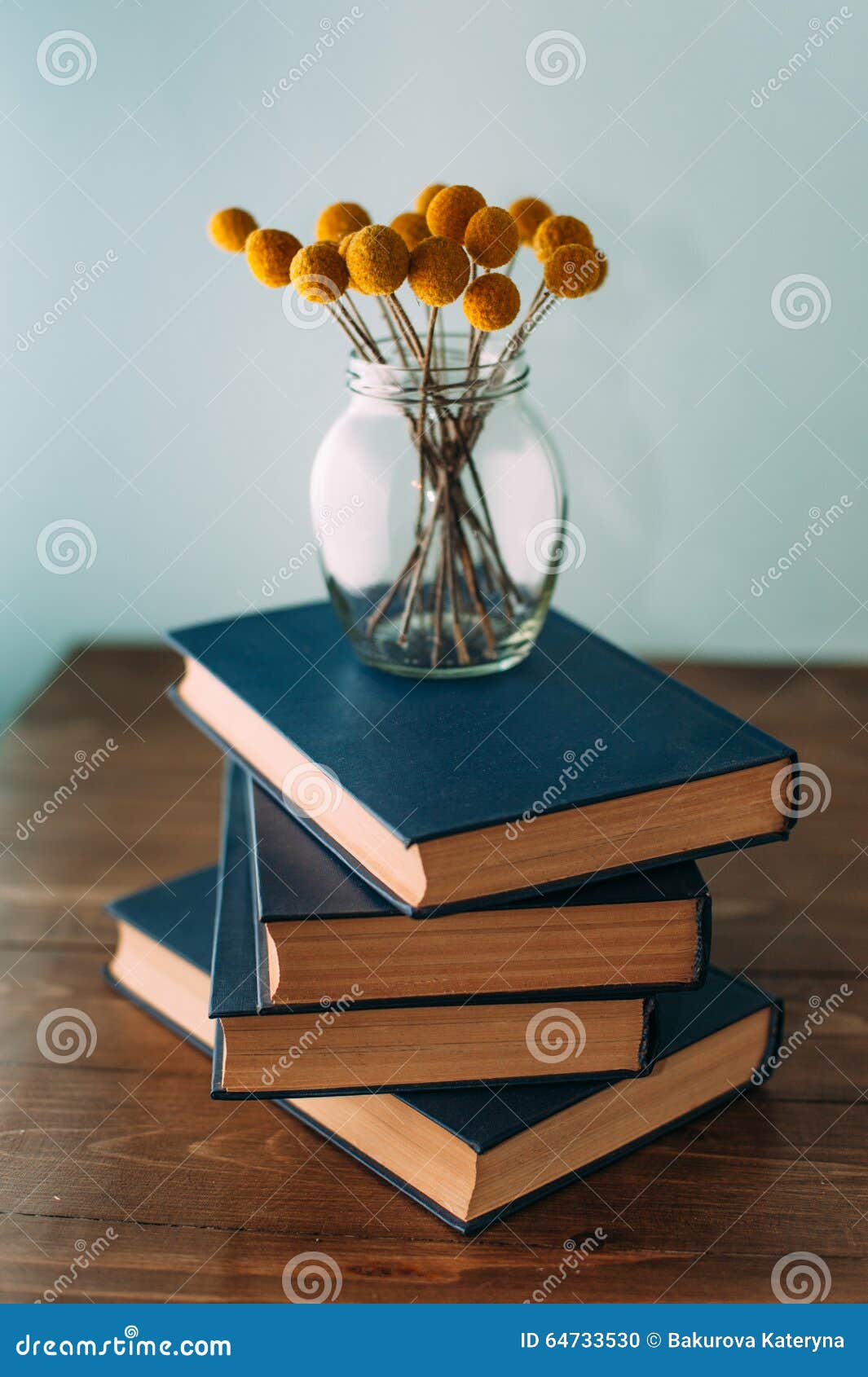 Stack of books and flowers stock photo. Image of blue - 64733530