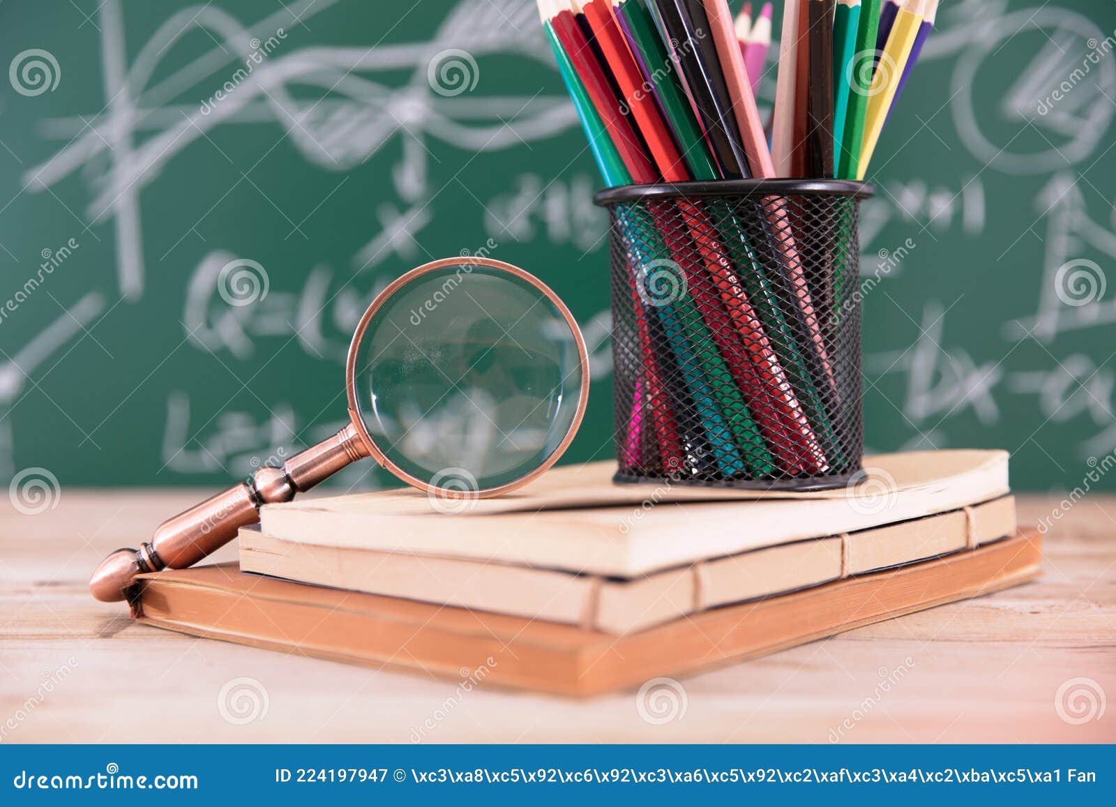 A Stack of Books in Front of a Blackboard Full of Mathematical Formulas ...