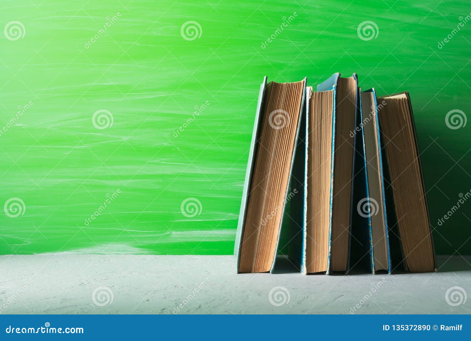 Stack of Books on Green Background Stock Photo - Image of intelligence ...