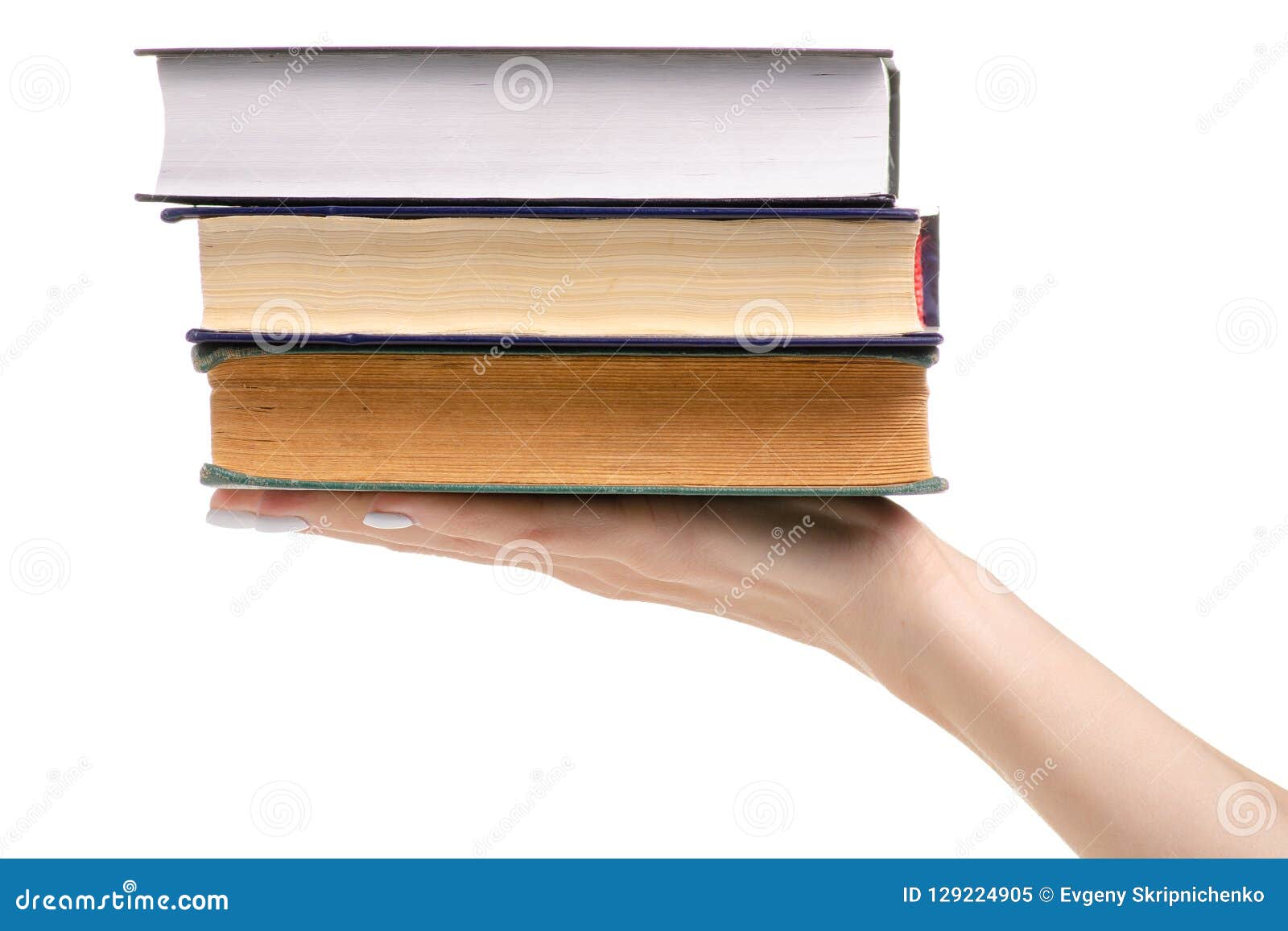 Stack of books in hands stock image. Image of concept - 129224905