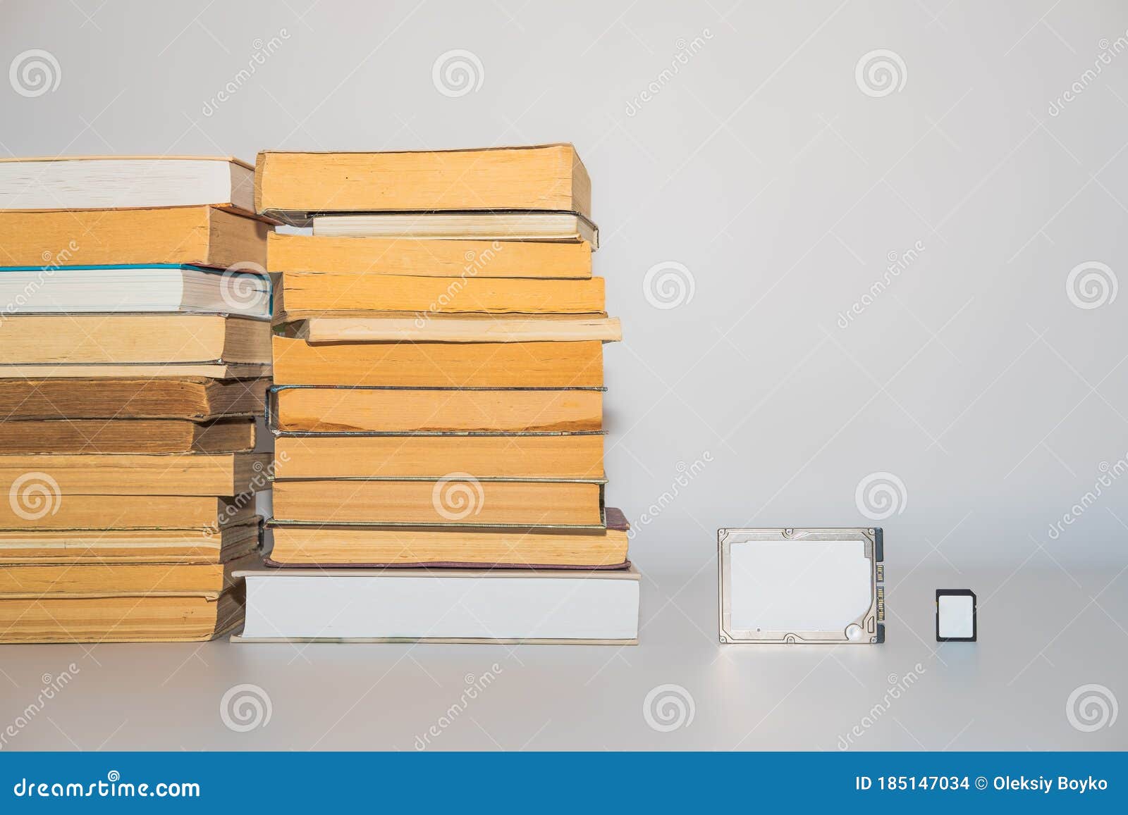 Stack of Books, Hard Disk Drive and Memory Card, Development of ...
