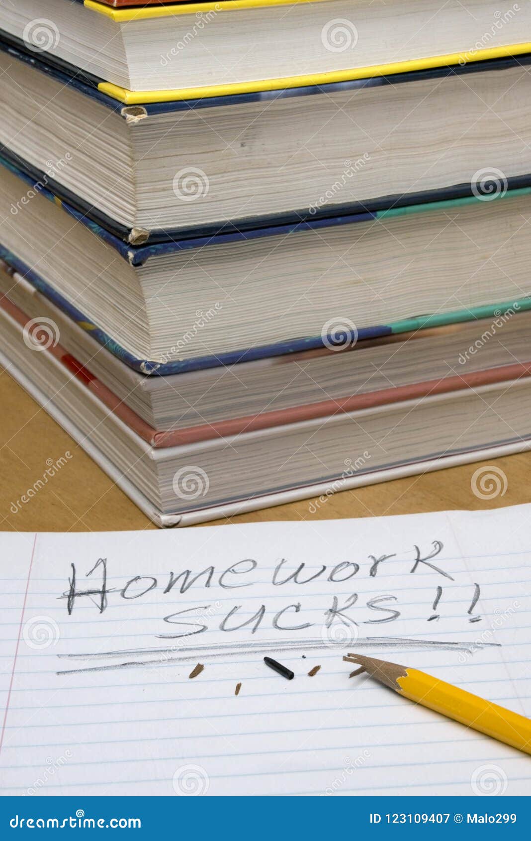 Stack of Books with Homework Sucks Written in Notebook Stock Image ...