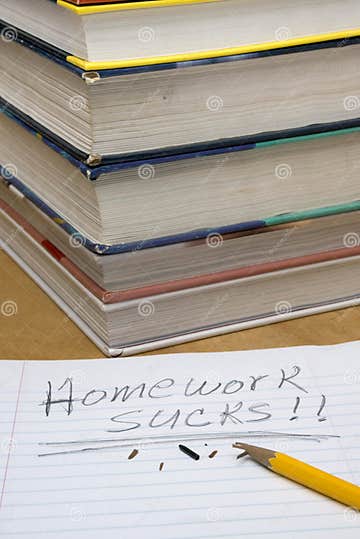Stack of Books with Homework Sucks Written in Notebook Stock Image ...