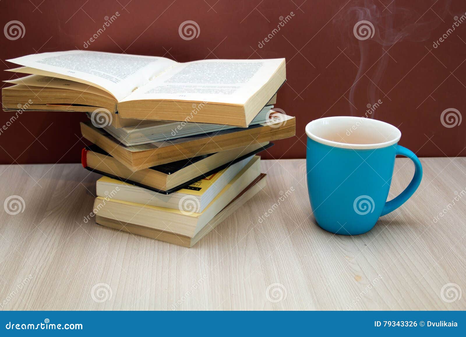 A Stack of Books and a Hot Drink in a Blue Mug Stock Photo - Image of ...
