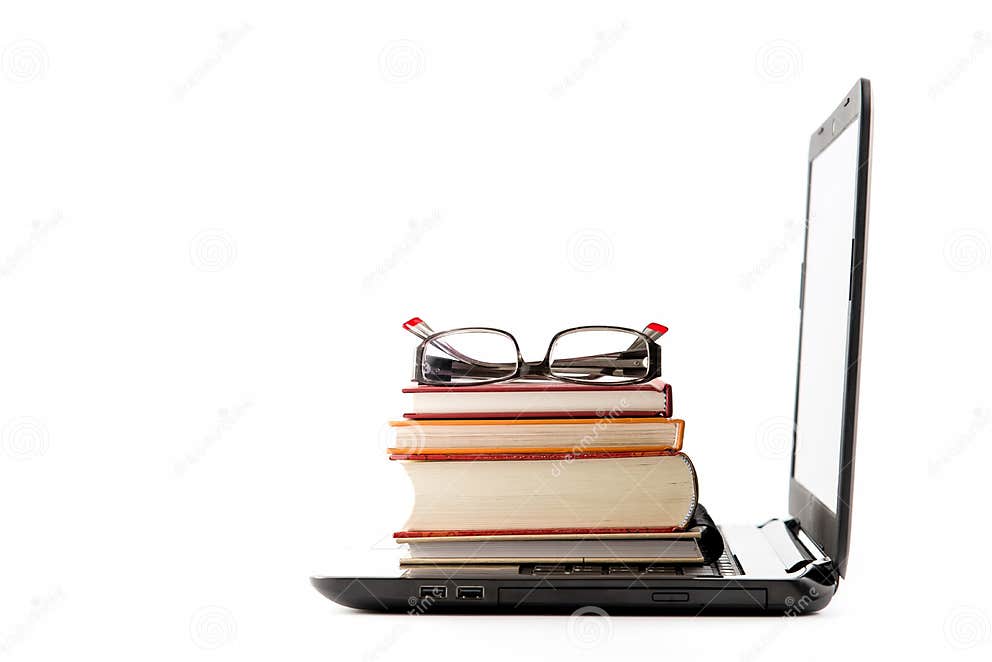Stack of books on laptop stock photo. Image of still - 39248950