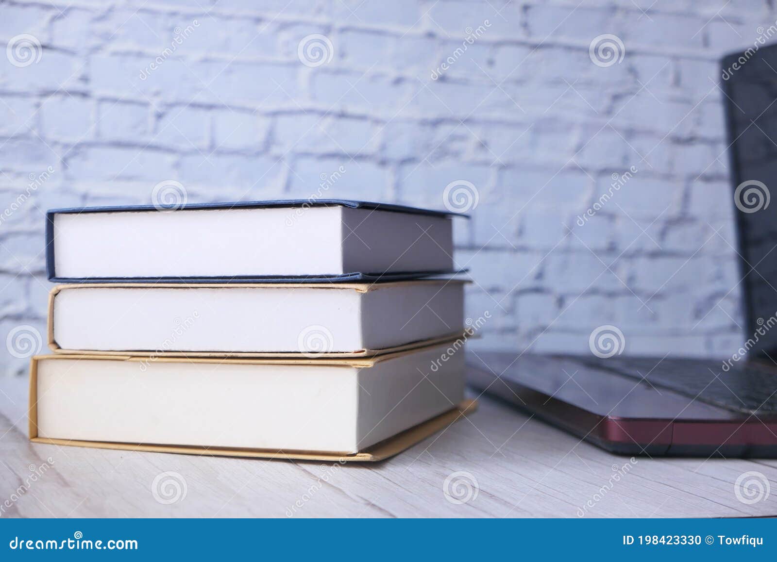 Stack of Books and Laptop on Table Stock Photo - Image of education ...