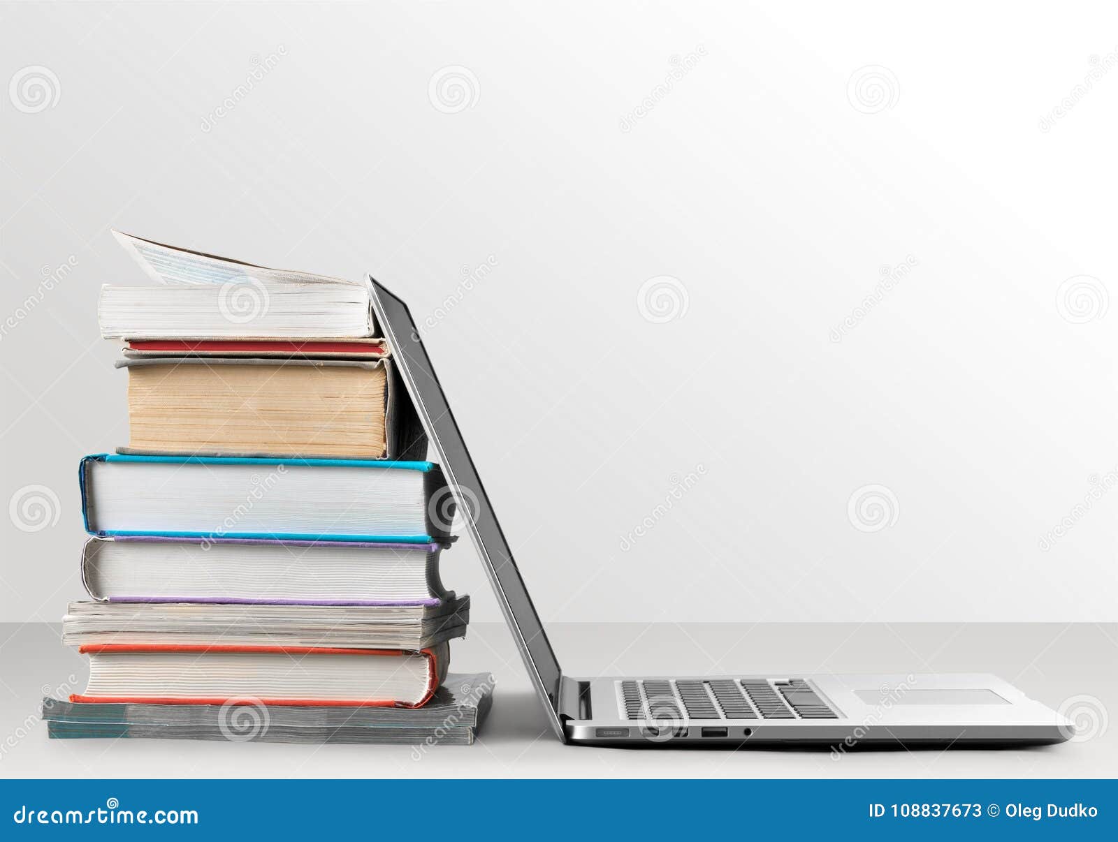 Stack of Books with Laptop on Table Stock Image - Image of pile ...
