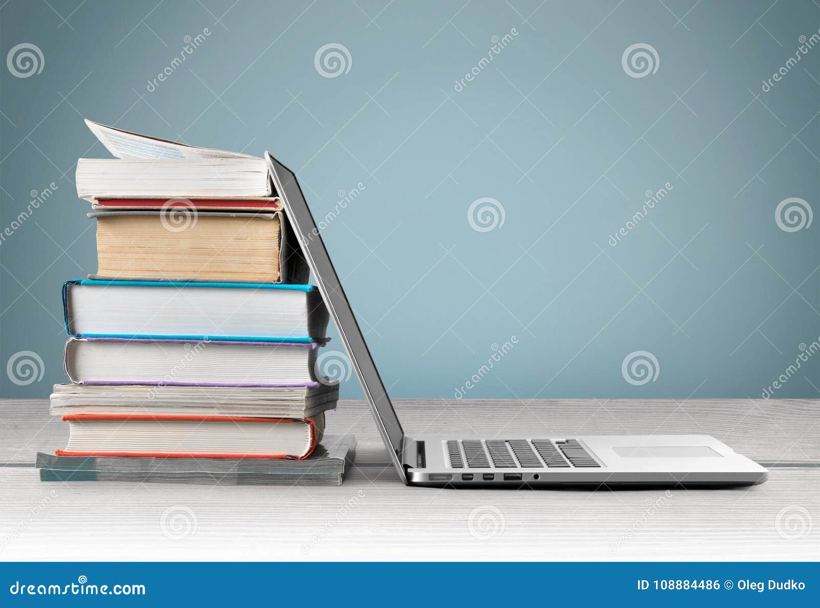 Stack of Books with Laptop on Table Stock Photo - Image of ...