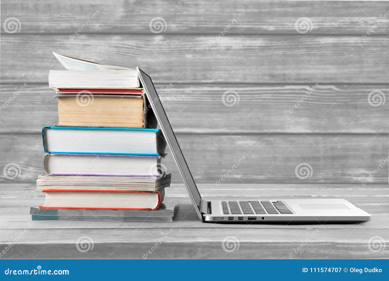 Stack of Books with Laptop on Wooden Background Stock Image - Image of ...