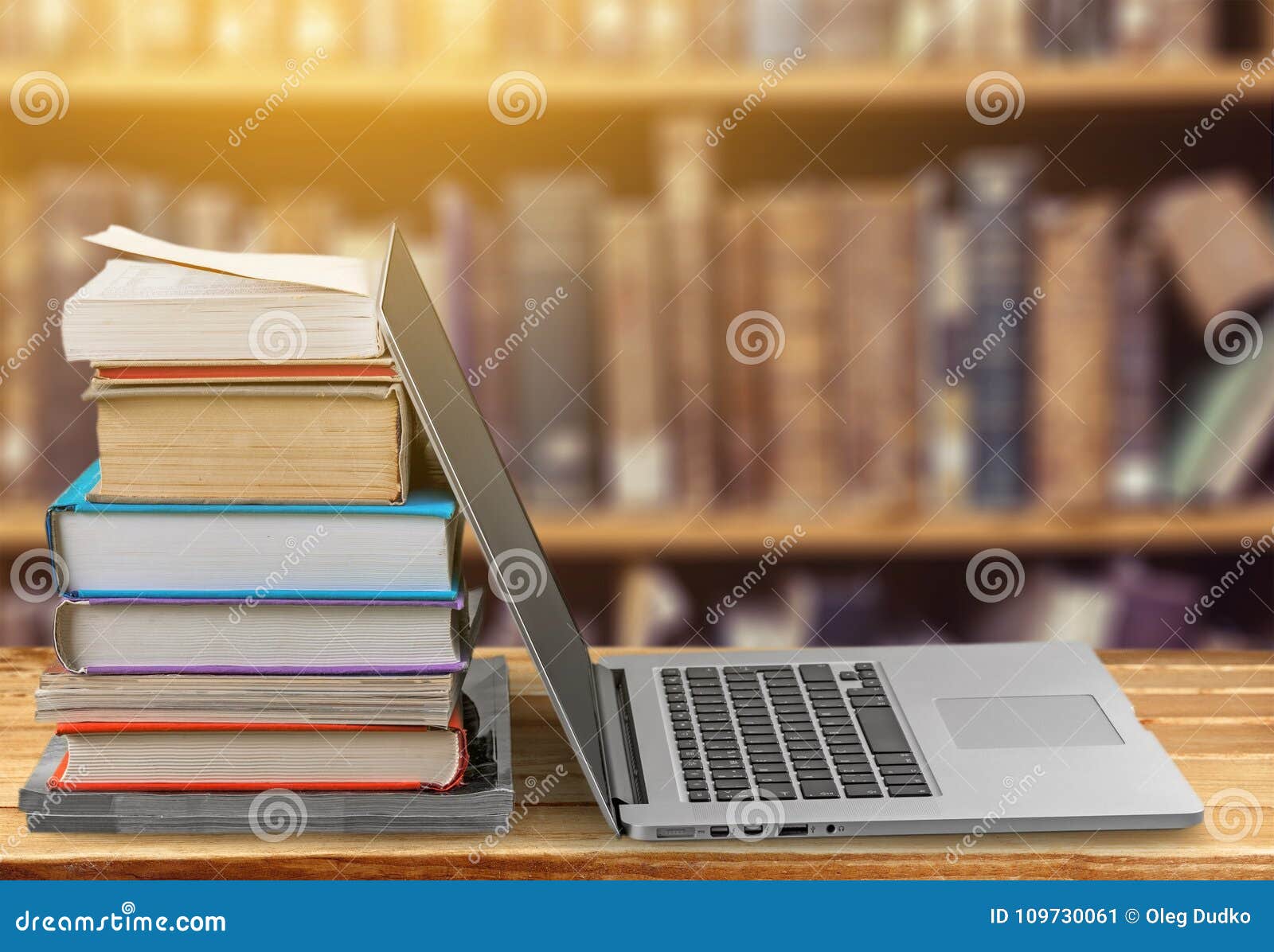 Stack of Books with Laptop on Wooden Table Stock Image - Image of ...