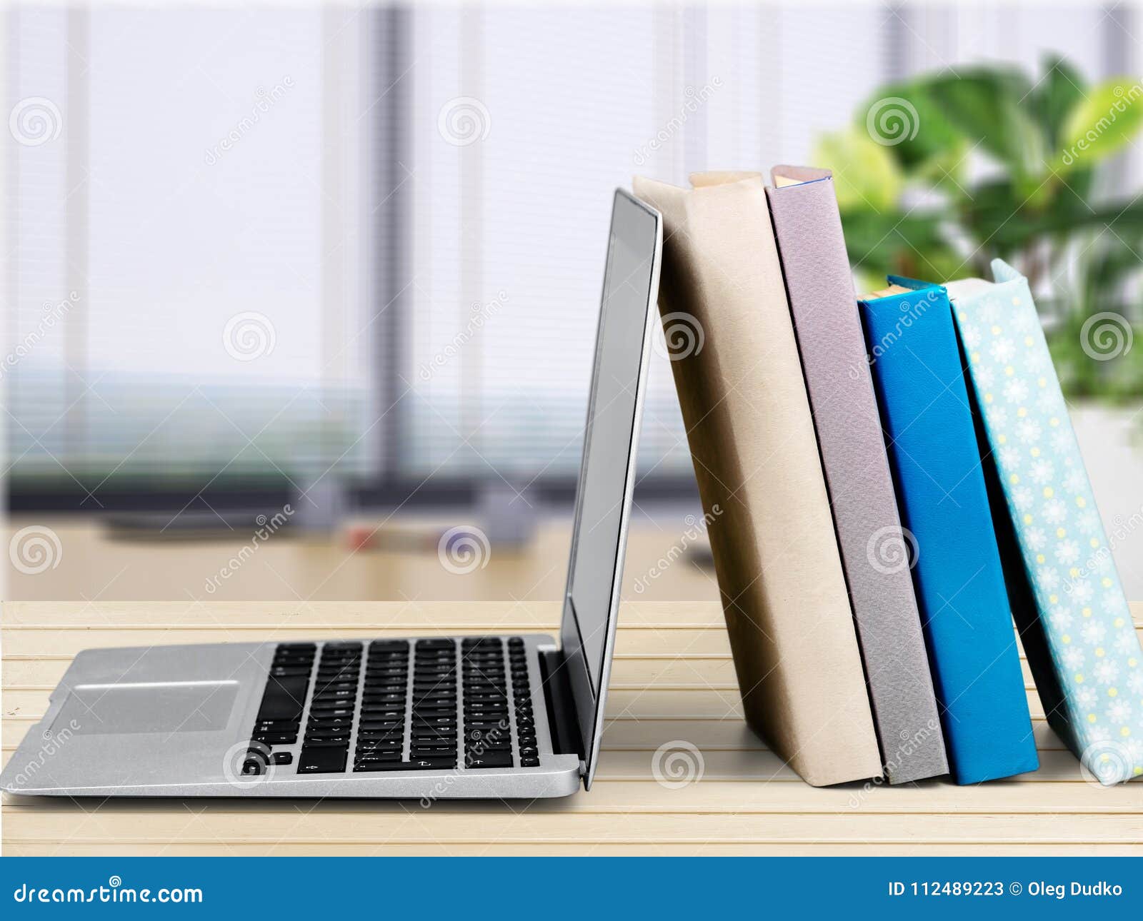 Stack of Books with Laptop on Wooden Table Stock Image - Image of ...
