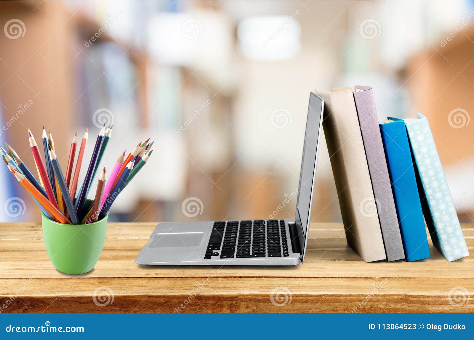 Stack of Books with Laptop on Wooden Table Stock Image - Image of ...
