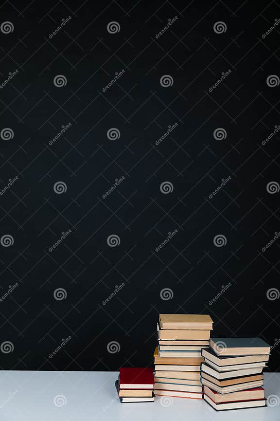 A Stack of Books in the Library on a Black Background Training ...
