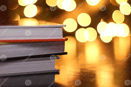 Stack of Books with Lights stock image. Image of christmas - 36342115