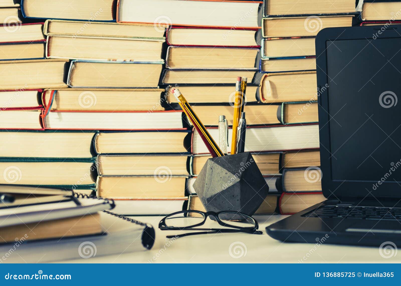 Stack of Books, Notebook, Laptop, Glasses in Office Background for ...