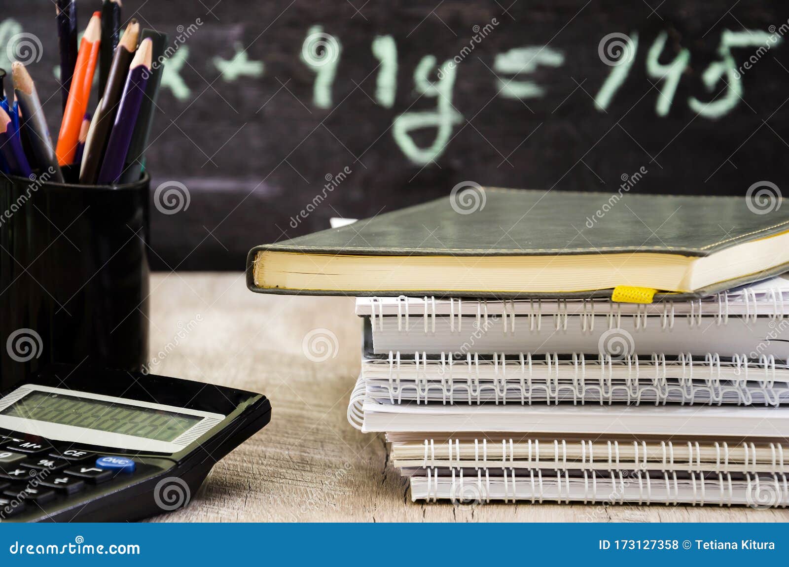 A Stack of Books, Notebooks, Pens and Writing Instruments Against a ...