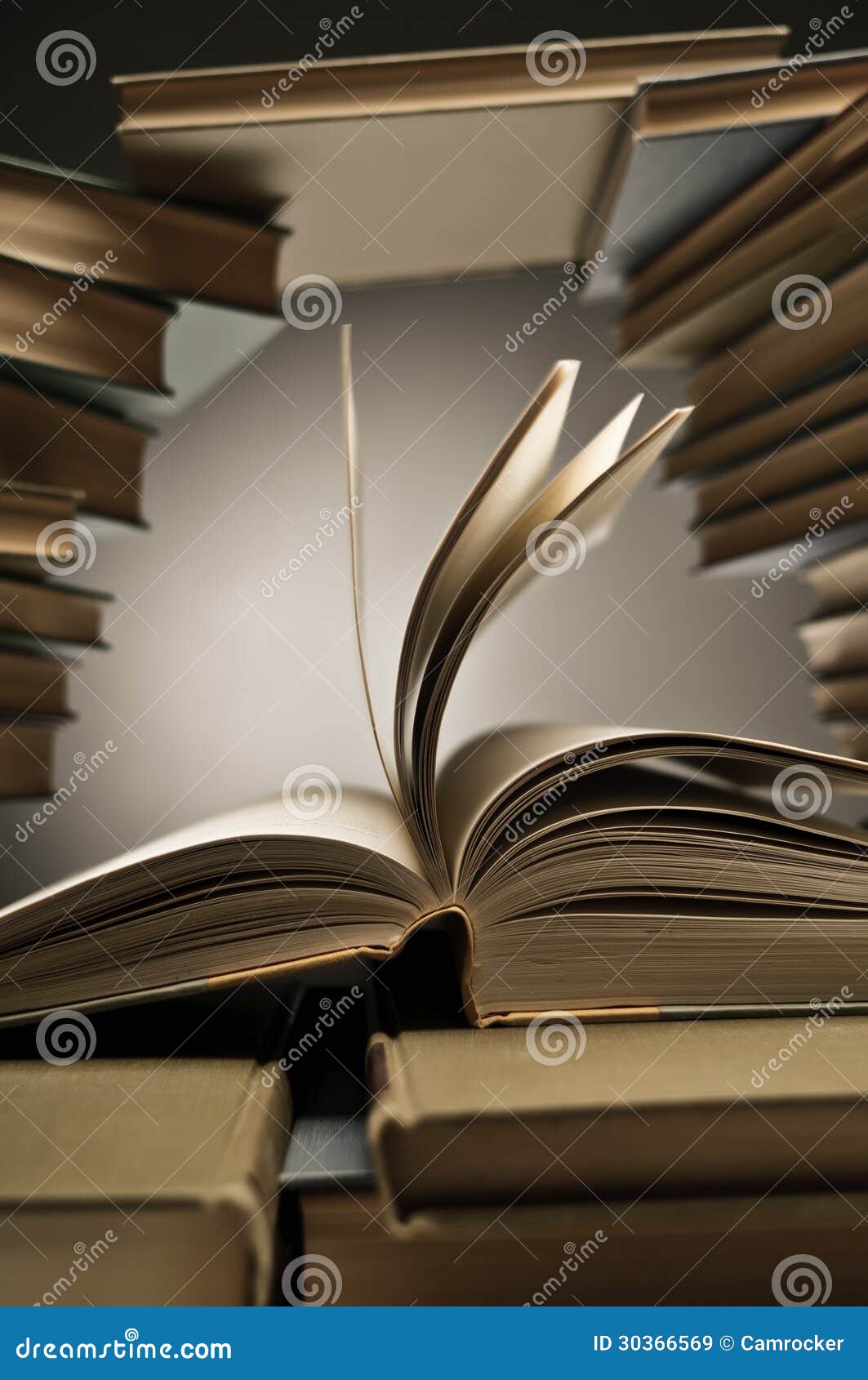 Stack of Books with One Open among Them Stock Image - Image of vertical ...