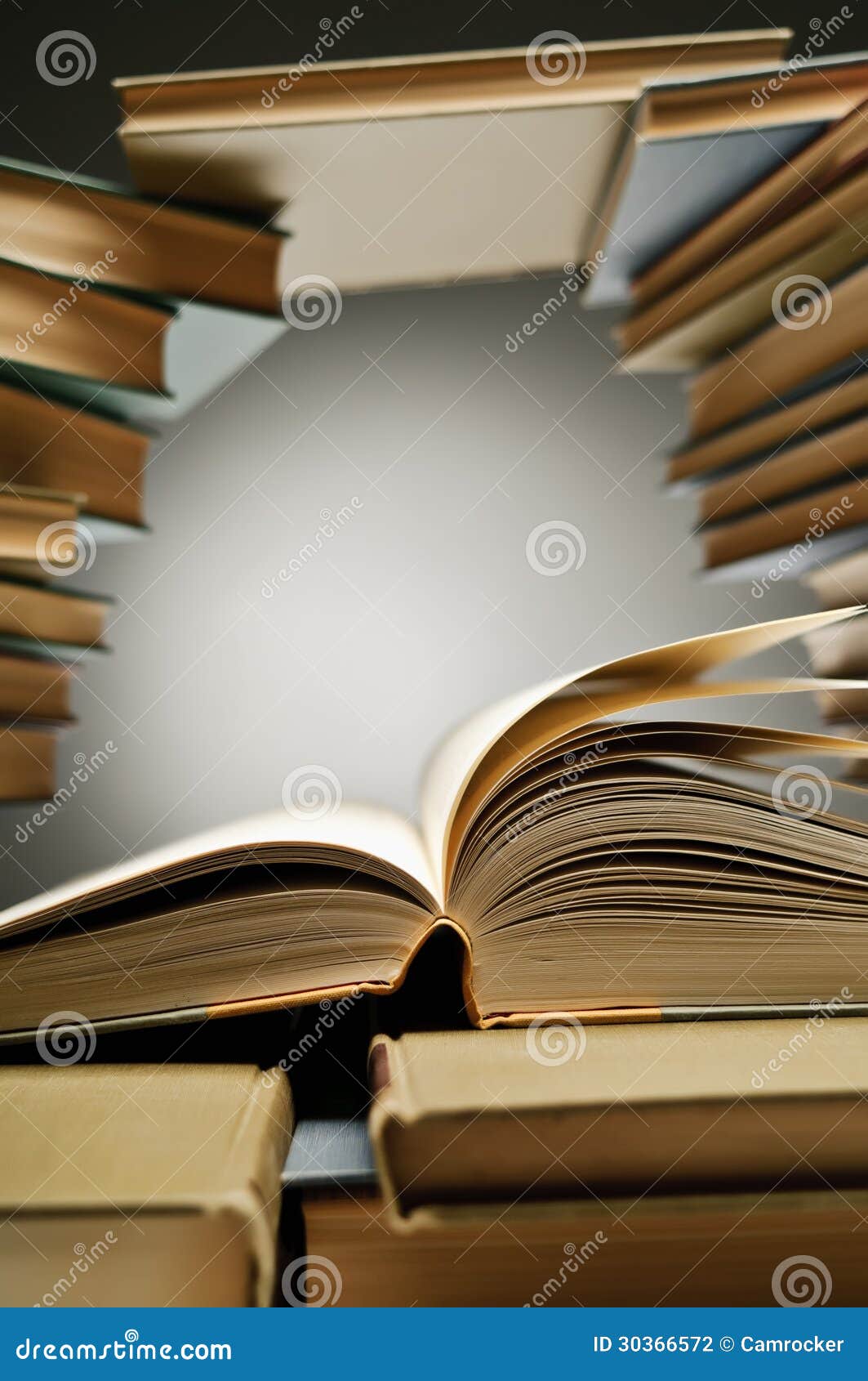 Stack of Books with One Open among Them Stock Photo - Image of studio ...