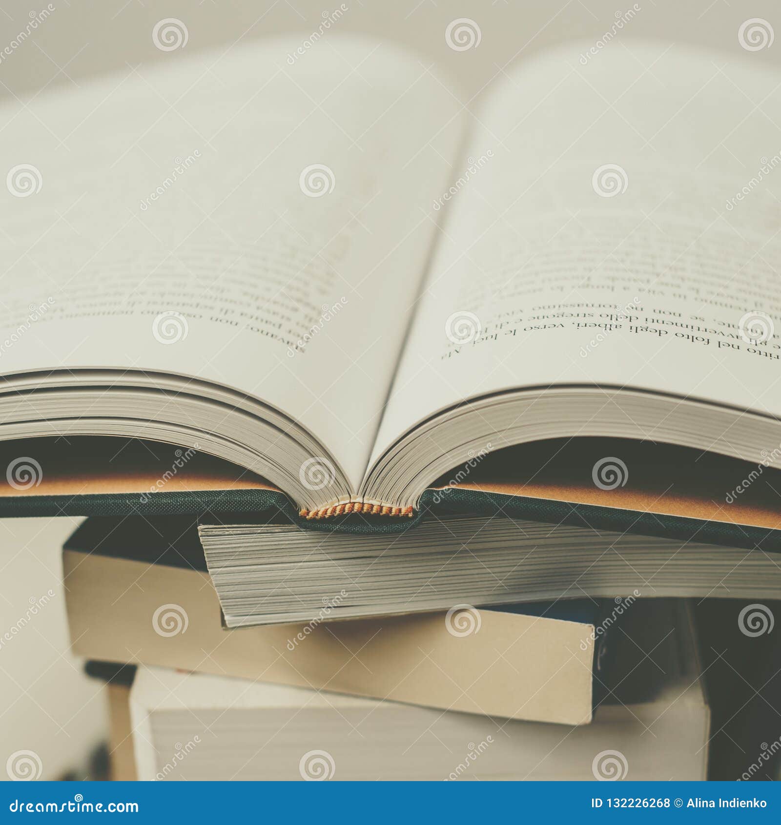 A Stack of Books with an Open Book, Pages. Reading Books, Studying ...