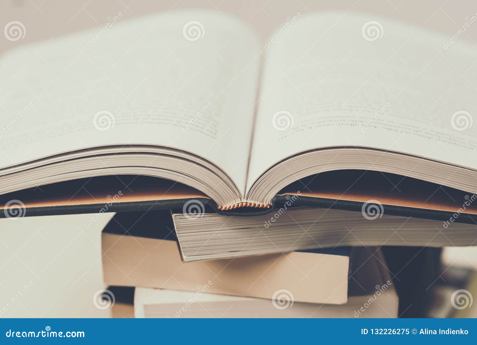 A Stack of Books with an Open Book, Pages. Reading Books, Studying ...