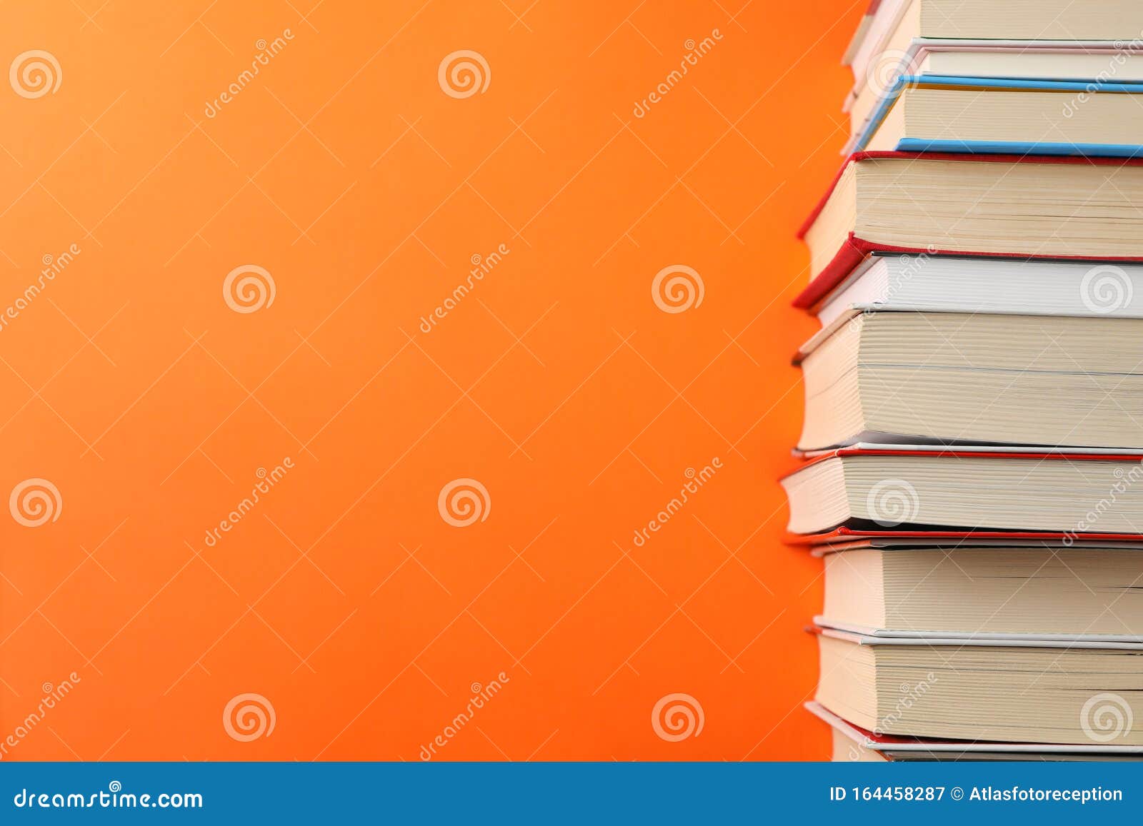 Stack of Books on Orange Background Stock Image - Image of text ...