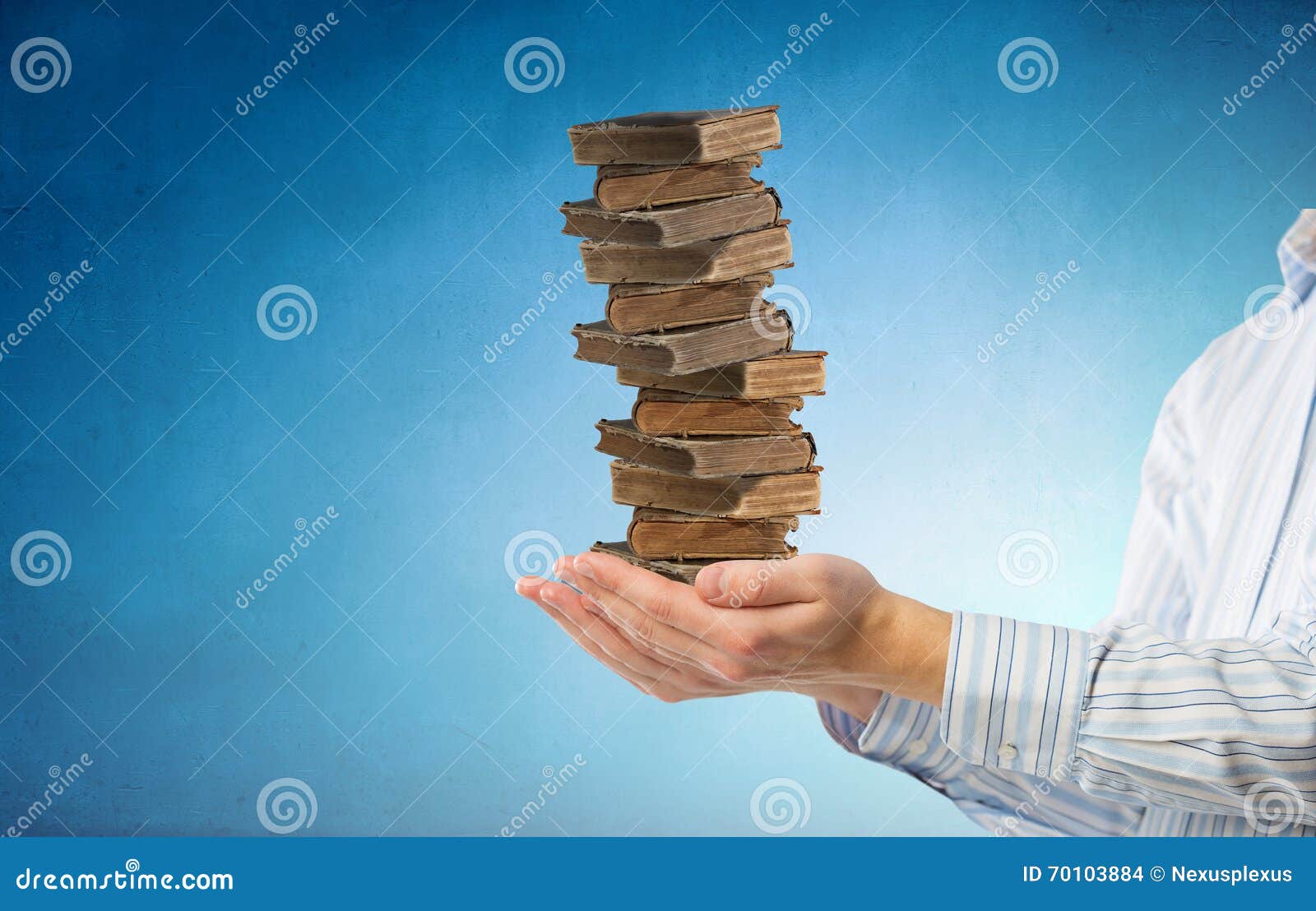 Stack of books in palms stock photo. Image of read, education - 70103884