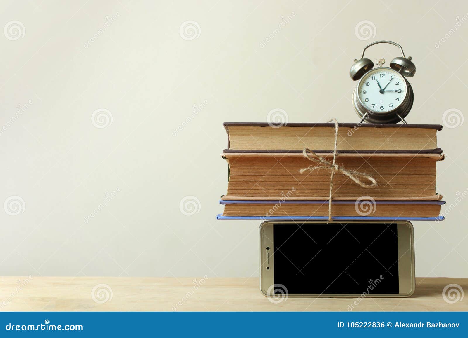 Stack of Books between the Phone and the Alarm Clock Stock Photo ... Stack of Books between the Phone and the Alarm Clock Stock Photo ...