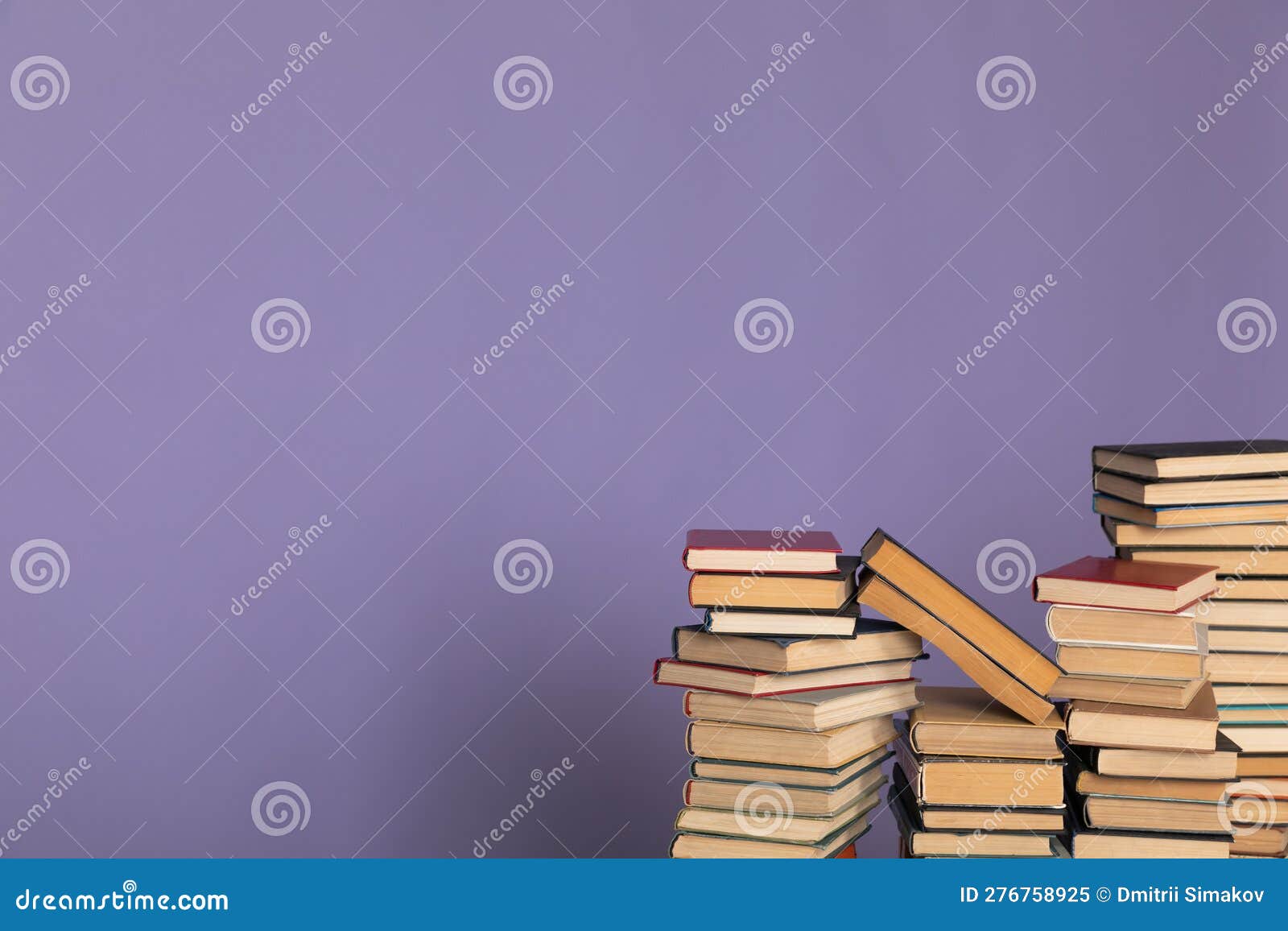 A Stack of Books on a Purple Background in the Library in the Office ...