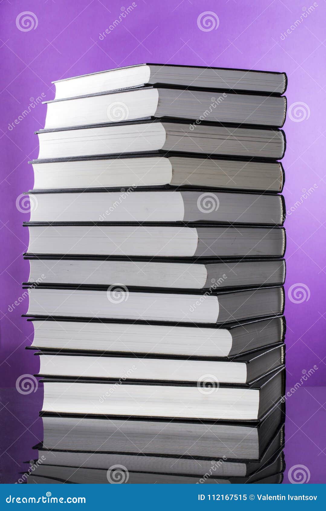 Stack of Books on a Purple Background. Stock Image - Image of printed ...