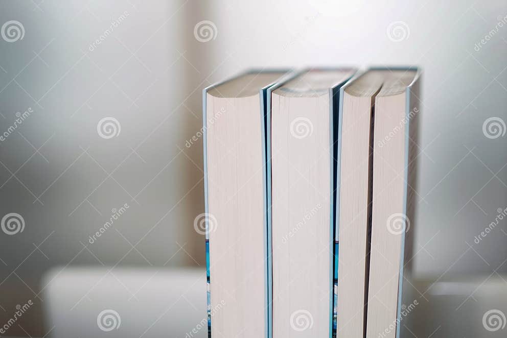 Stack of books on a shelf stock image. Image of unfocused - 149388887