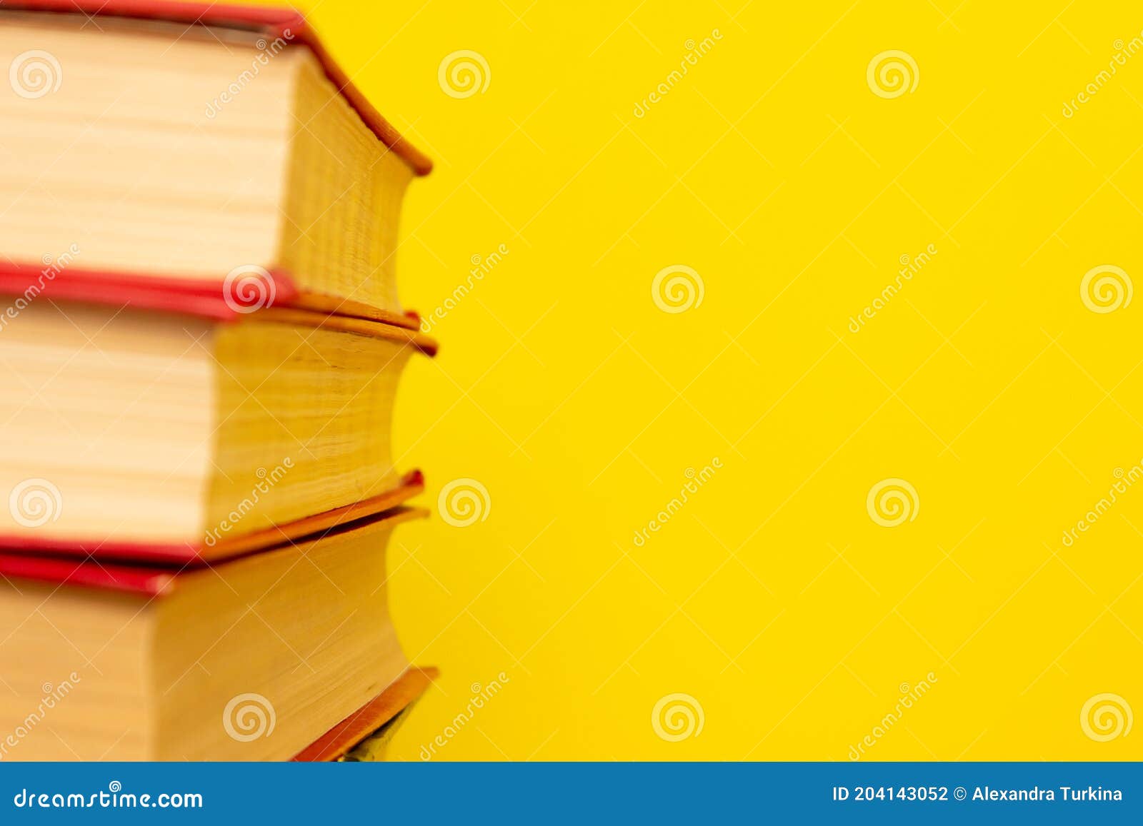 Stack of Books on the Side, Bright Yellow Background, Free Space for ...