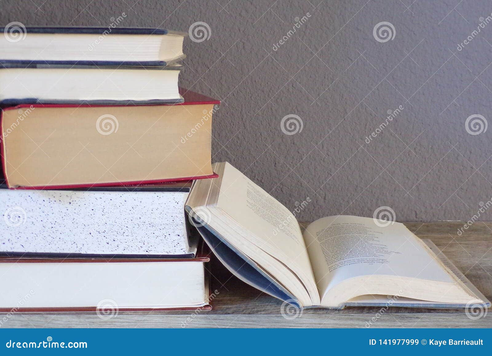 Stack of Books Sitting on a Table with One Open. Stock Image - Image of ...