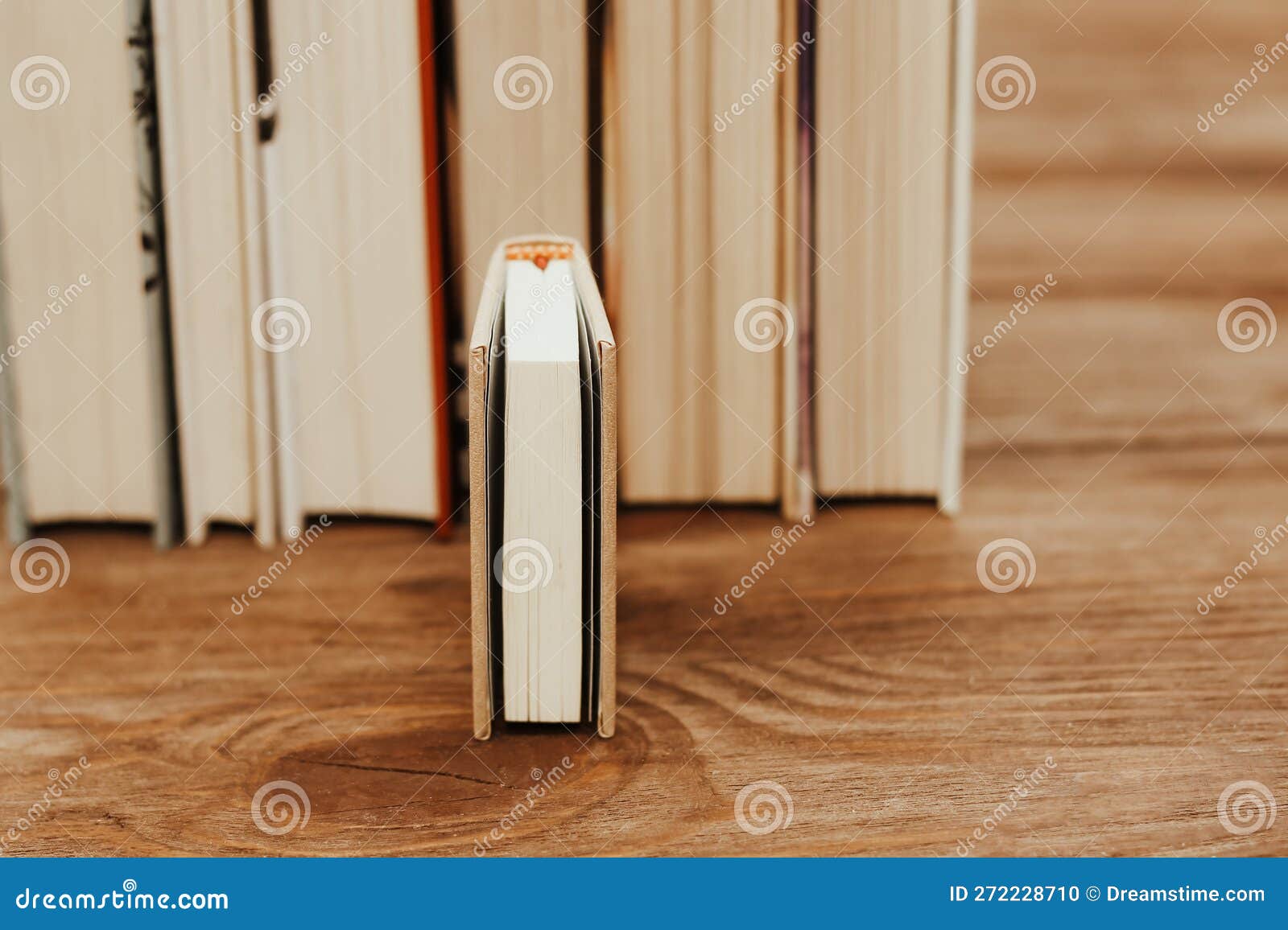 A Stack of Books Stand on the Tables, Stacked in the Frame, Next To ...
