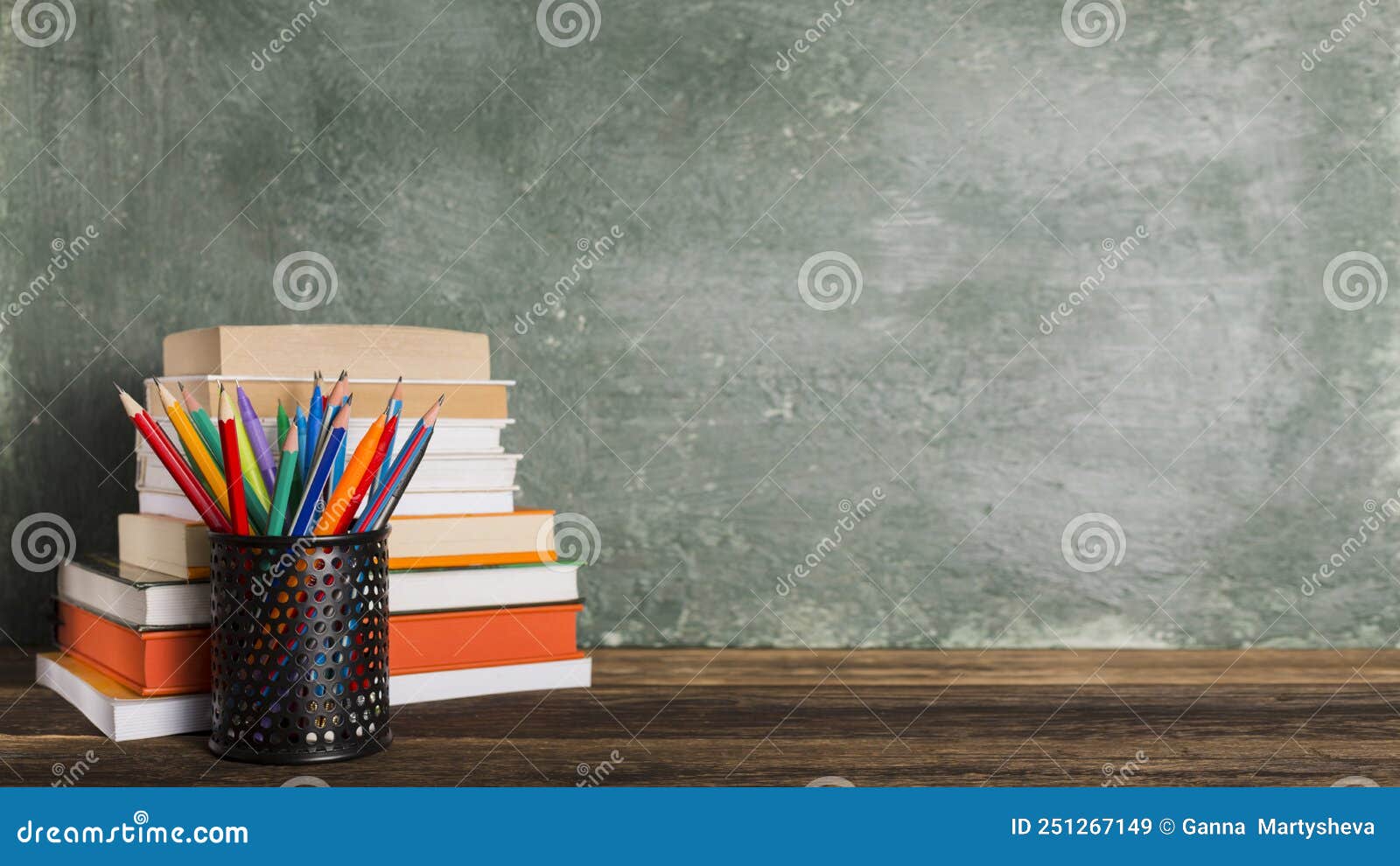 A Stack of Books and Stationery on the Background of the School Board ...