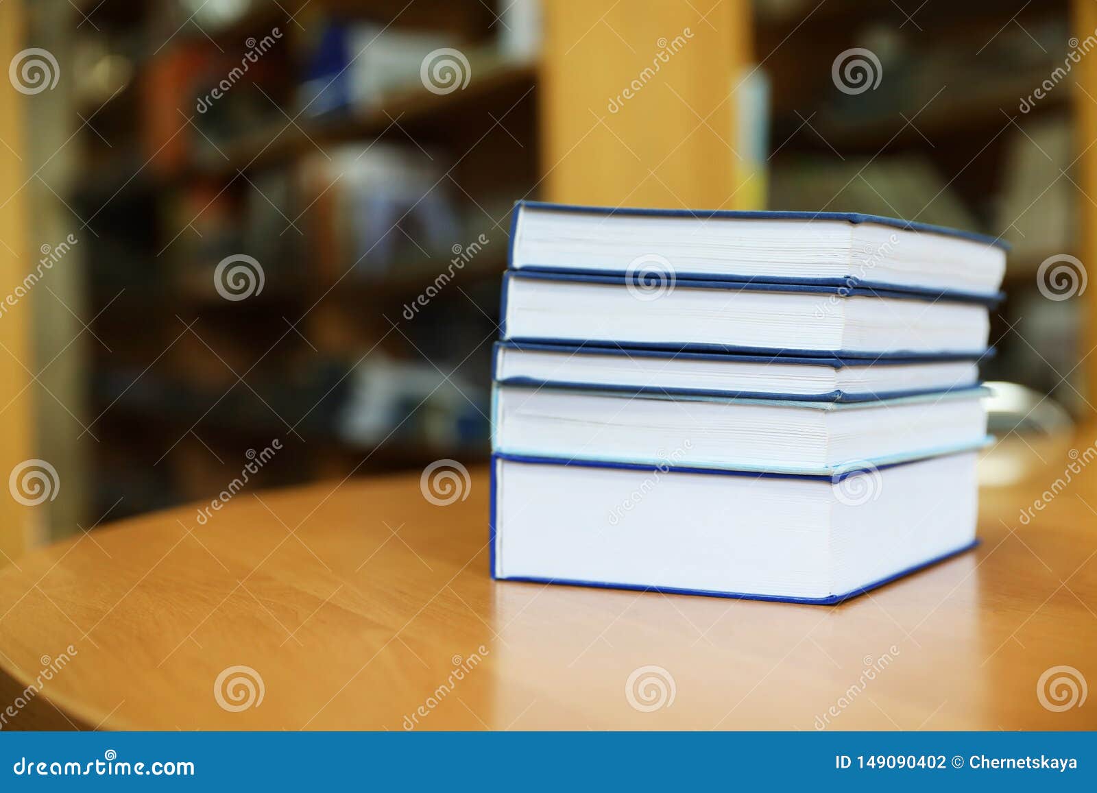 Stack of Books on Table in Library Stock Photo - Image of retail ...