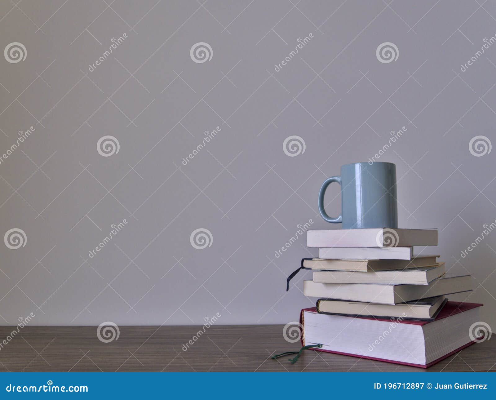 Stack of Books on a Table with Light Colored Background.Education ...