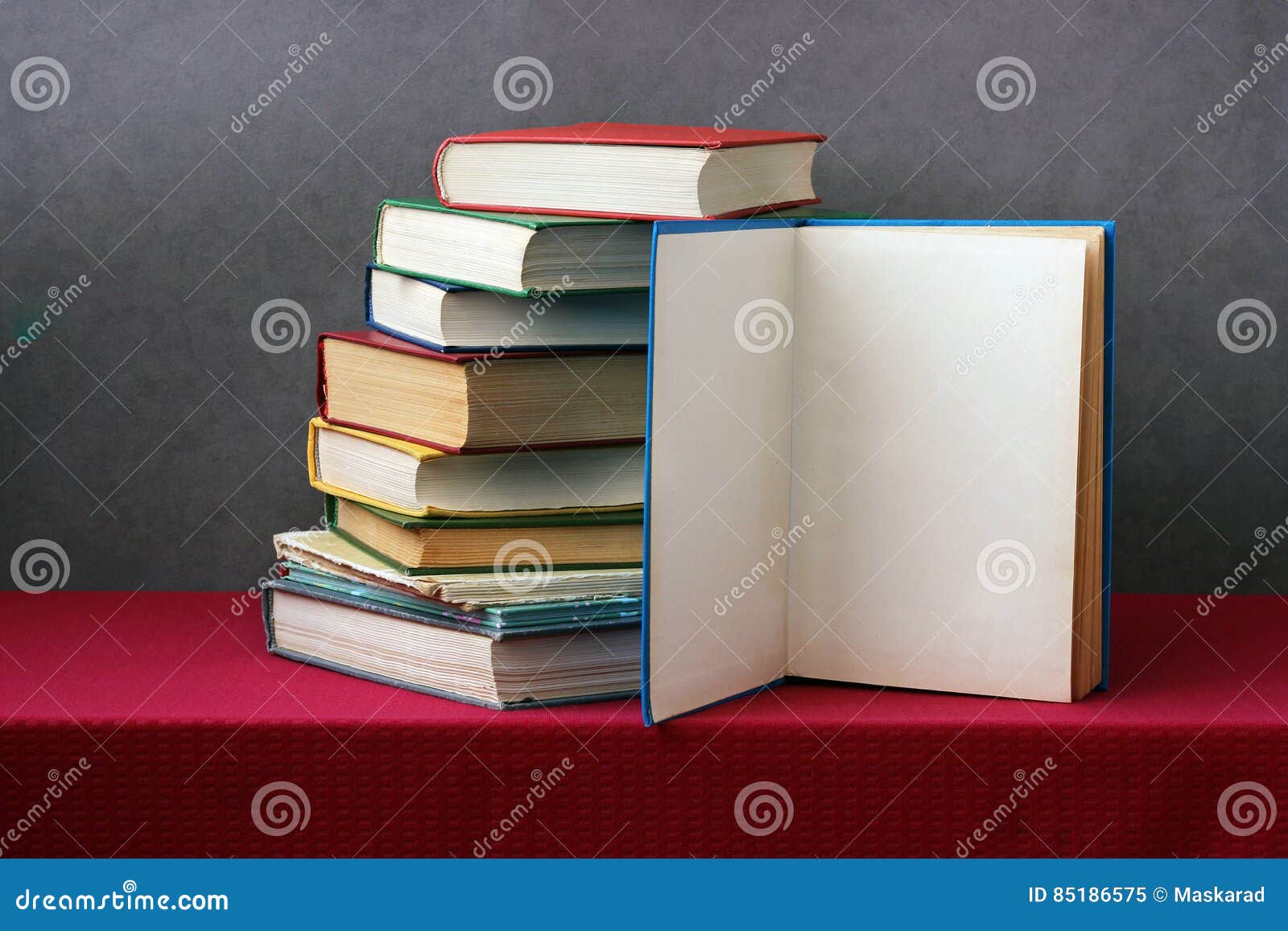 Stack of Books on the Table, One Book Opened. Stock Image - Image of ...