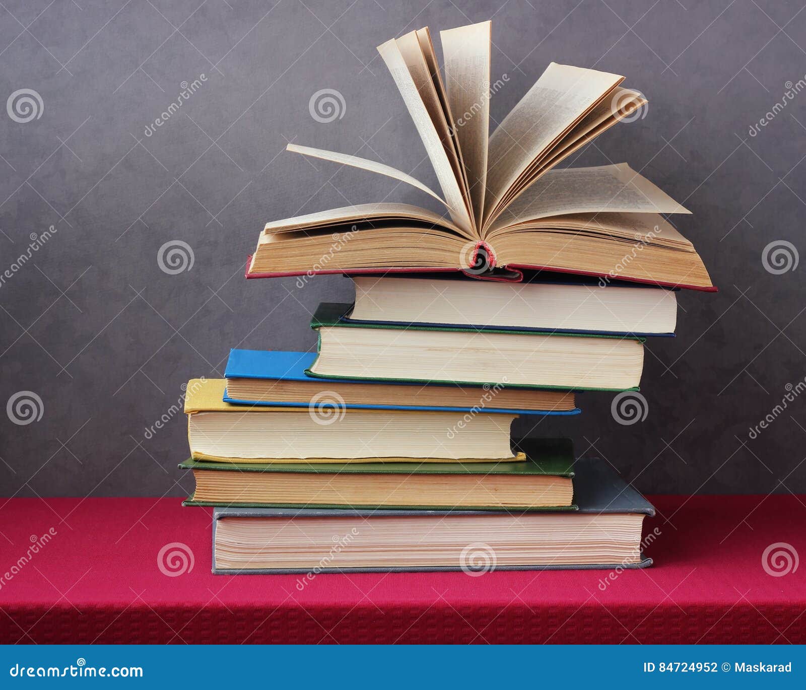 Stack of Books on the Table with a Red Tablecloth. Stock Photo - Image ...