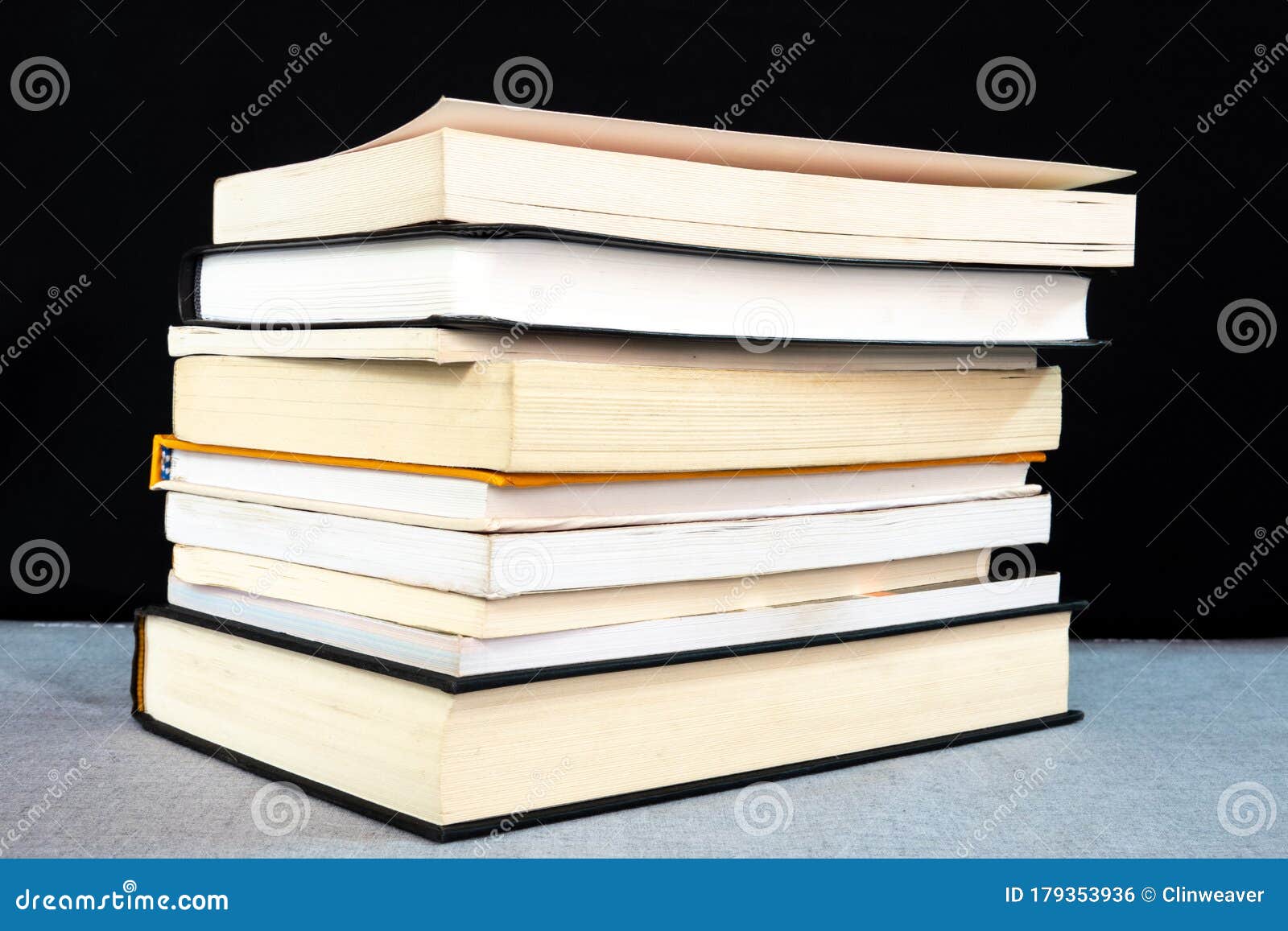 Stack of Books on a Table stock photo. Image of isolated - 179353936