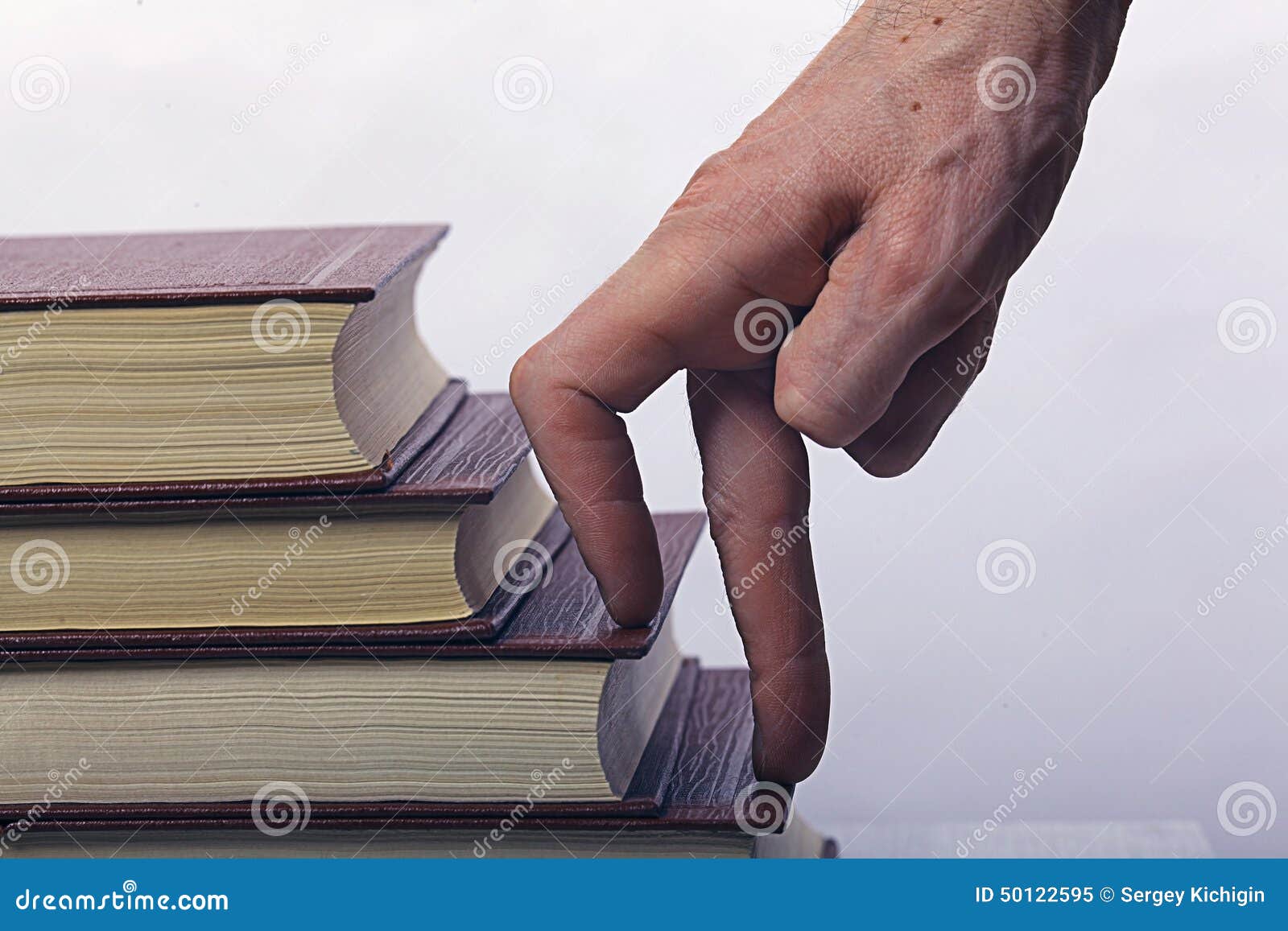Stack of books thumbs hand stock image. Image of fingers - 50122595