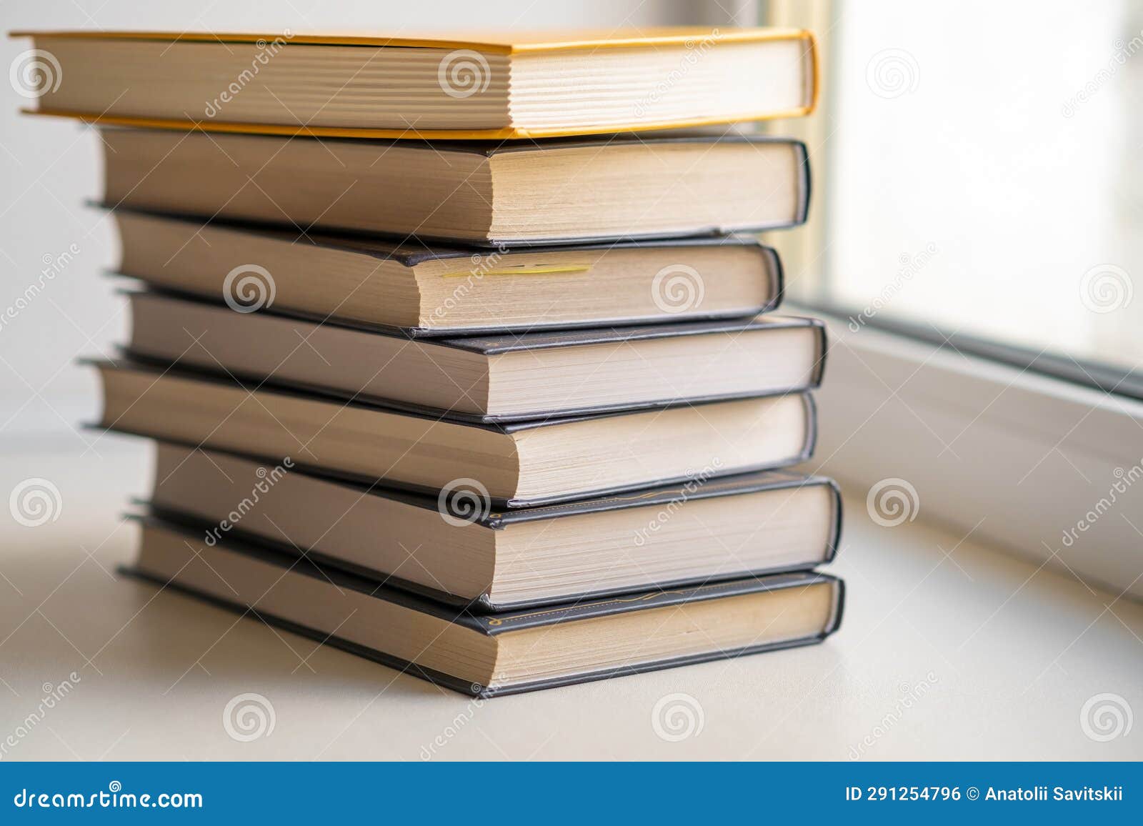Stack of Books on a White Background. One Book is Yellow Stock Photo ...